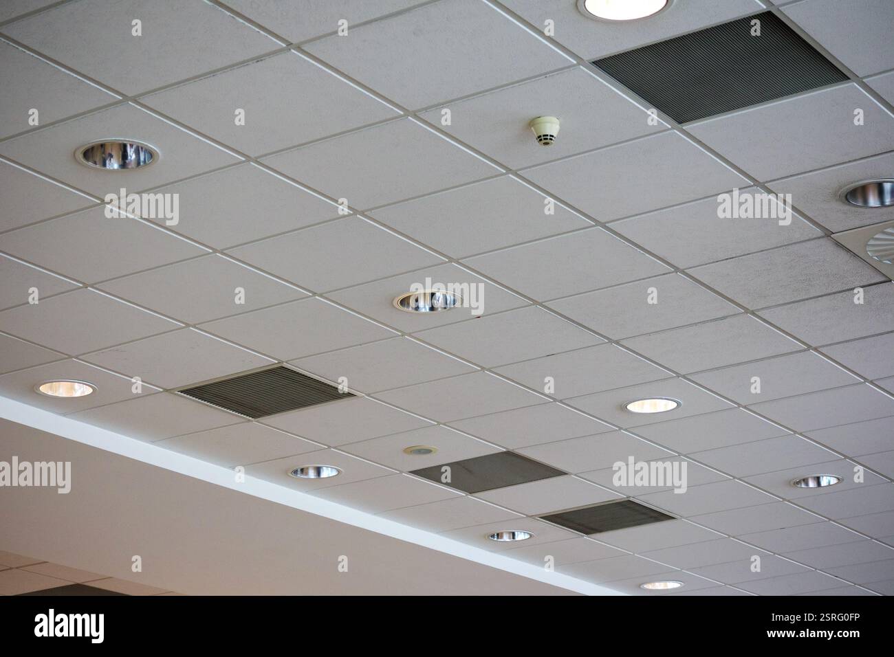 Ceiling with suspended ceiling panels and recessed lights Stock Photo ...