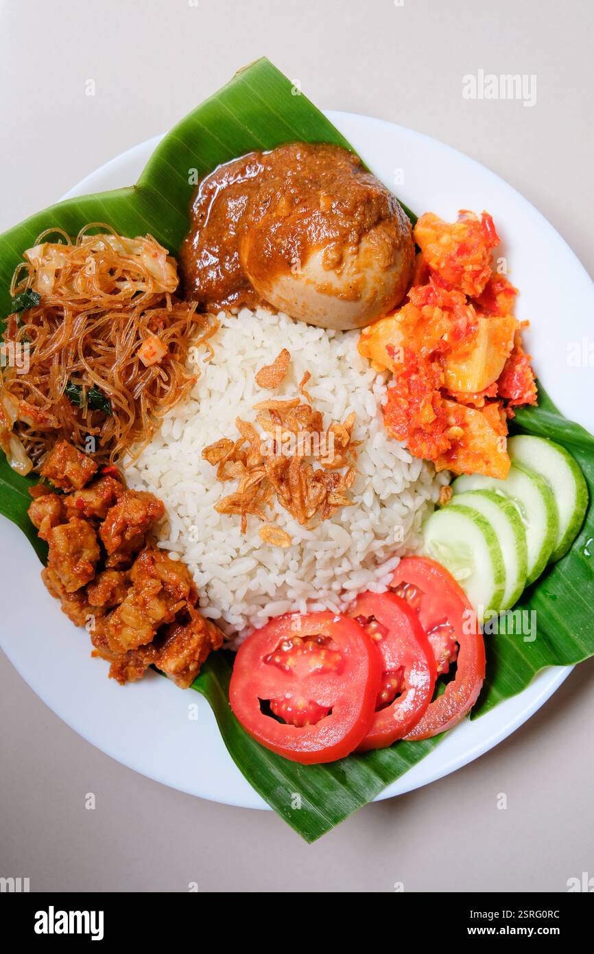 Indonesian traditional food, nasi uduk is a coconut-flavored steamed ...
