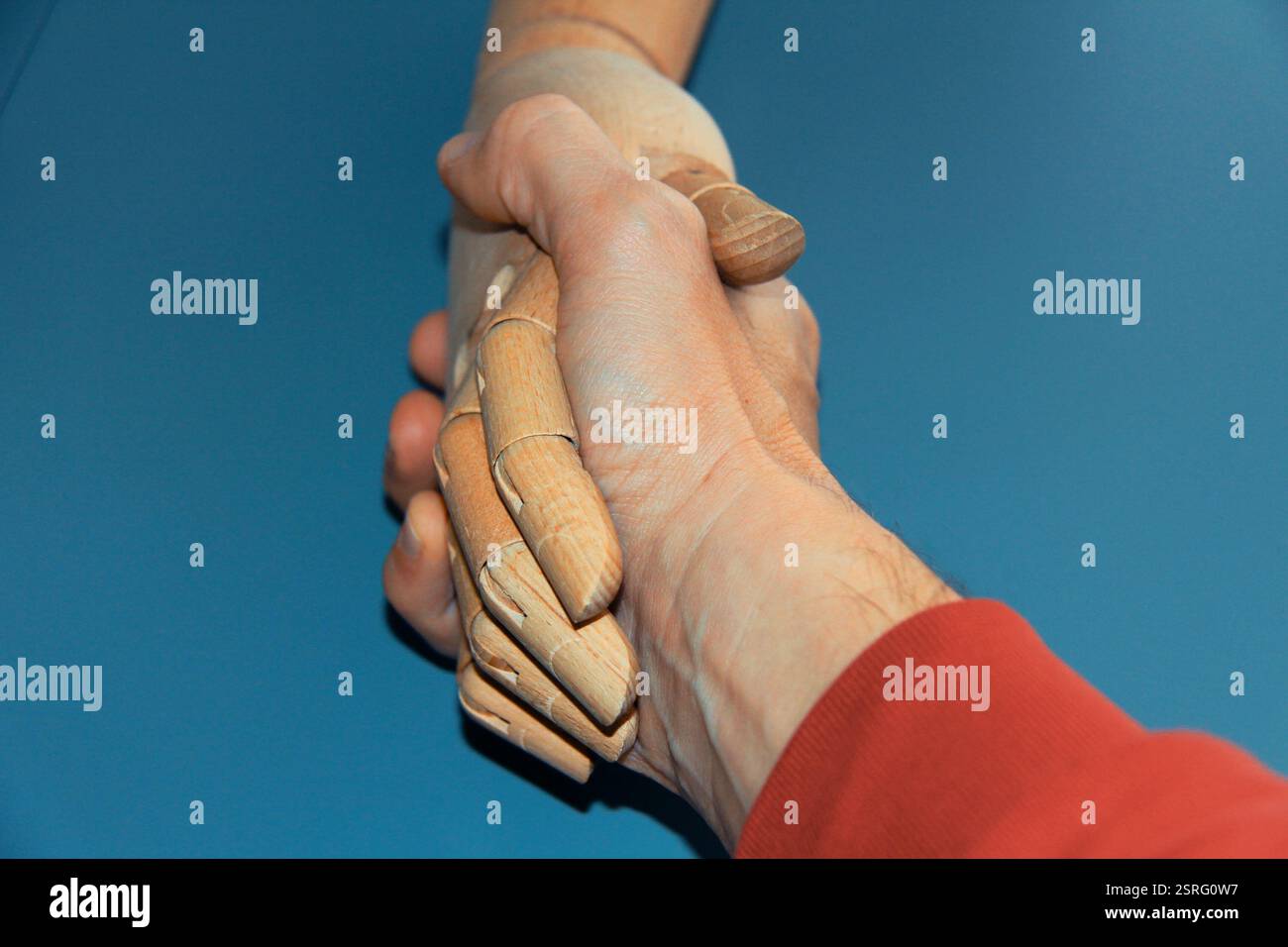 Robot and human handshake, joint efforts, collaboration Stock Photo - Alamy