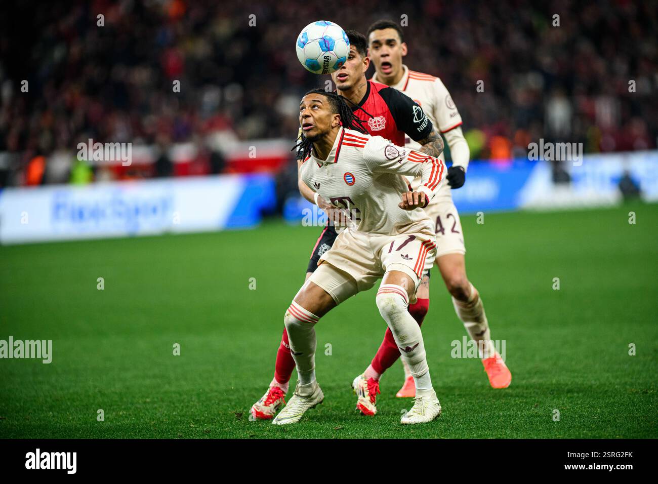 LEVERKUSEN, GERMANY - 15 FEBRUARY, 2025: Michael Olise, Piero Hincapie ...