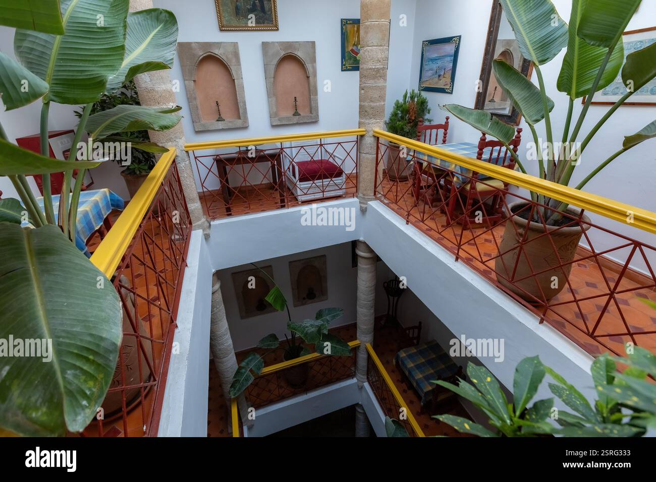 Internal yard of the old Riyad house with flowers decoration and white ...