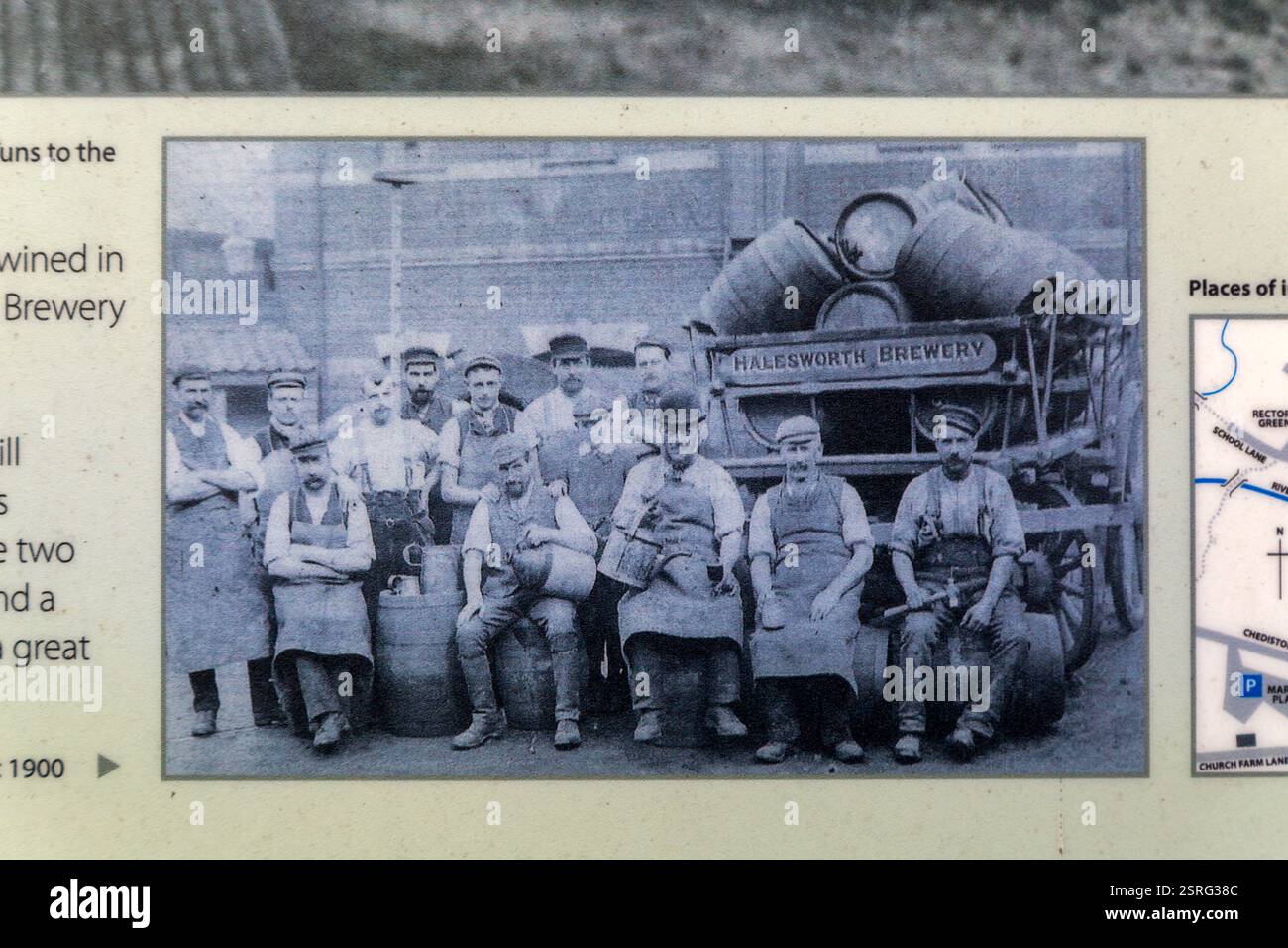 Old information notice with historic photo of male men brewery workers ...