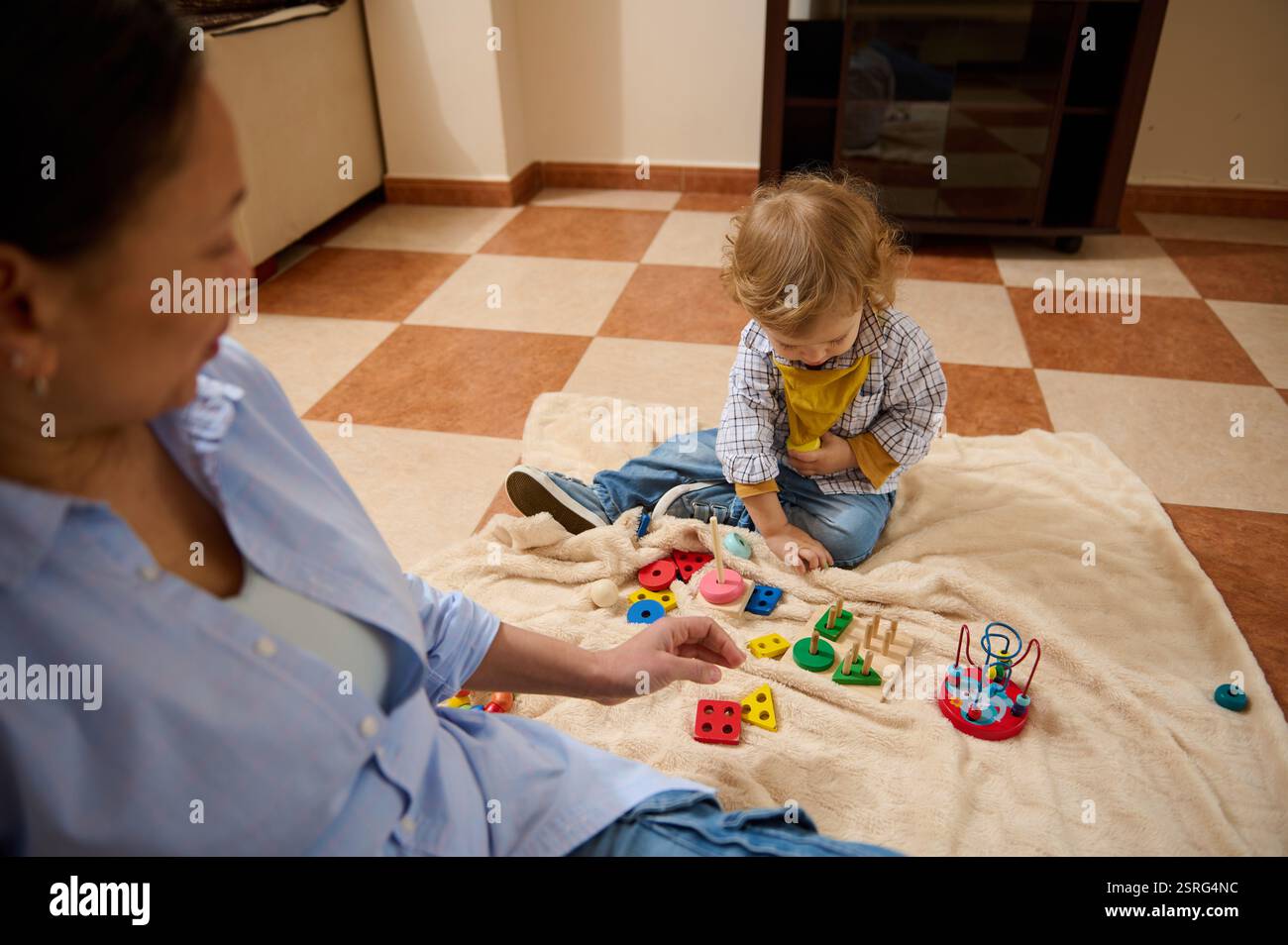 A caring mother spends quality time with her child, engaging in ...