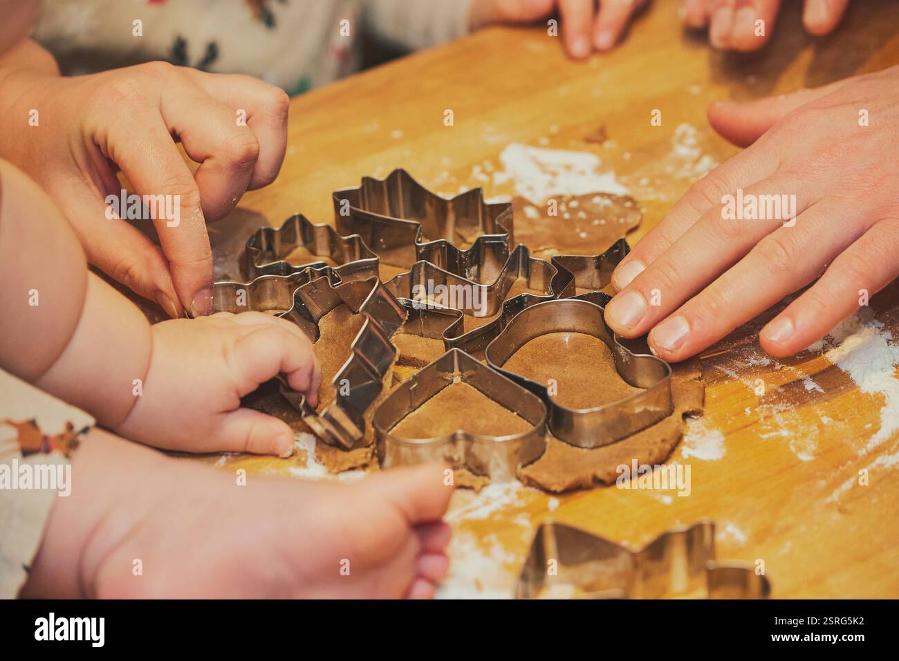 A family with children makes cookies. Close-up Stock Photo - Alamy