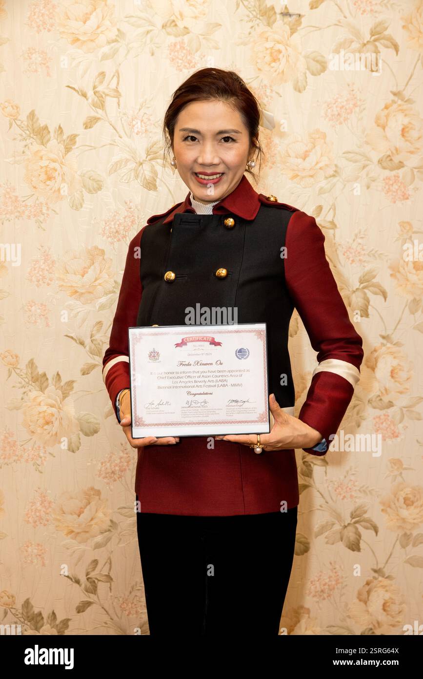 Freda Ou is holding her certificate of LABA Asian Chairman at Welcome ...
