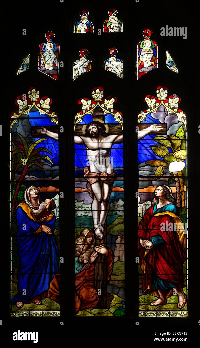 Stained glass window of Jesus Christ Crucifixion Cross, church of Saint John the Baptist ...
