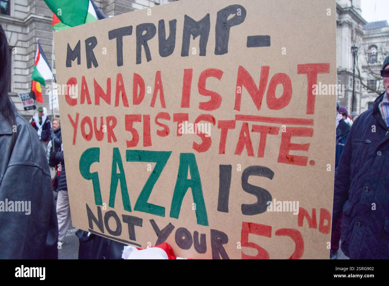 London, England, UK. 15th Feb, 2025. A protester holds a sign with a ...
