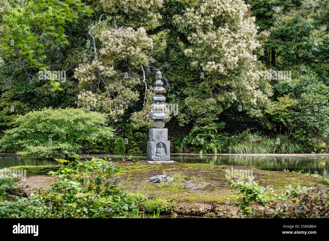 The White Snake stone Pagoda on the small mound at Kinkaku-ji temple ...