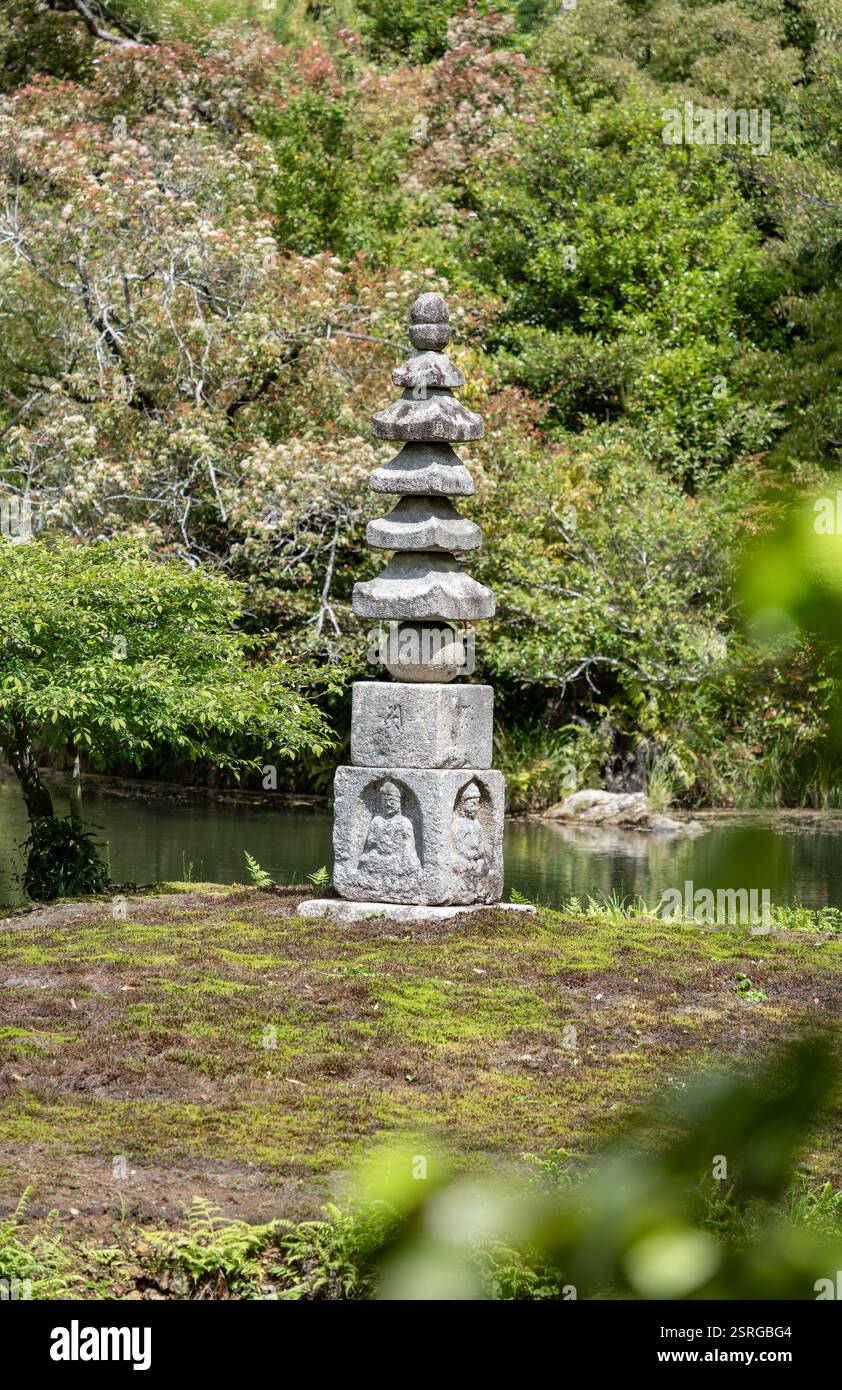 The White Snake stone Pagoda on the small mound at Kinkaku-ji temple ...