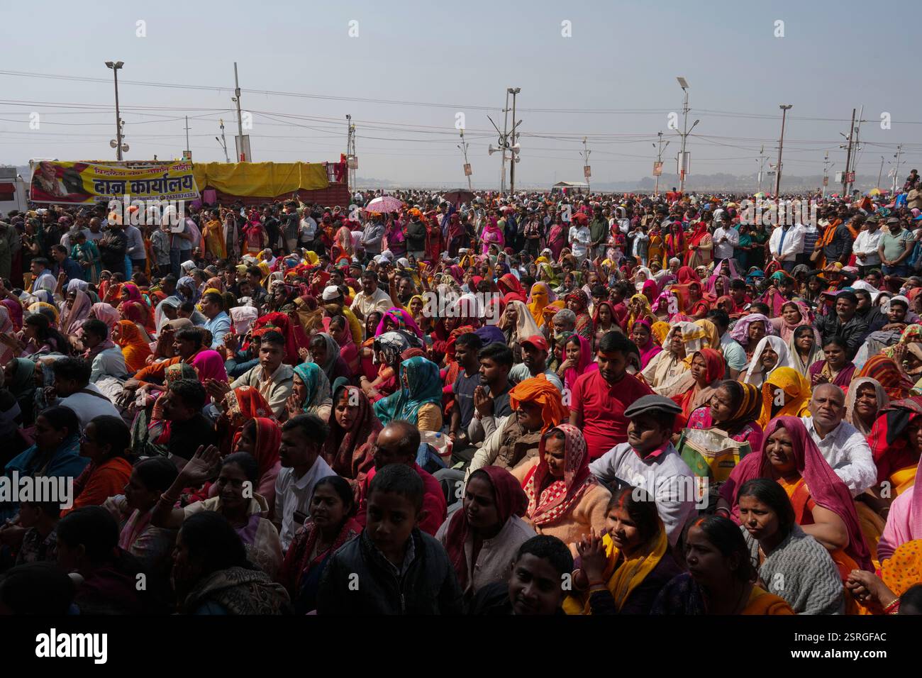 Hindu devotees listen to religious leader Pandit Pradeep Mishra at the ...