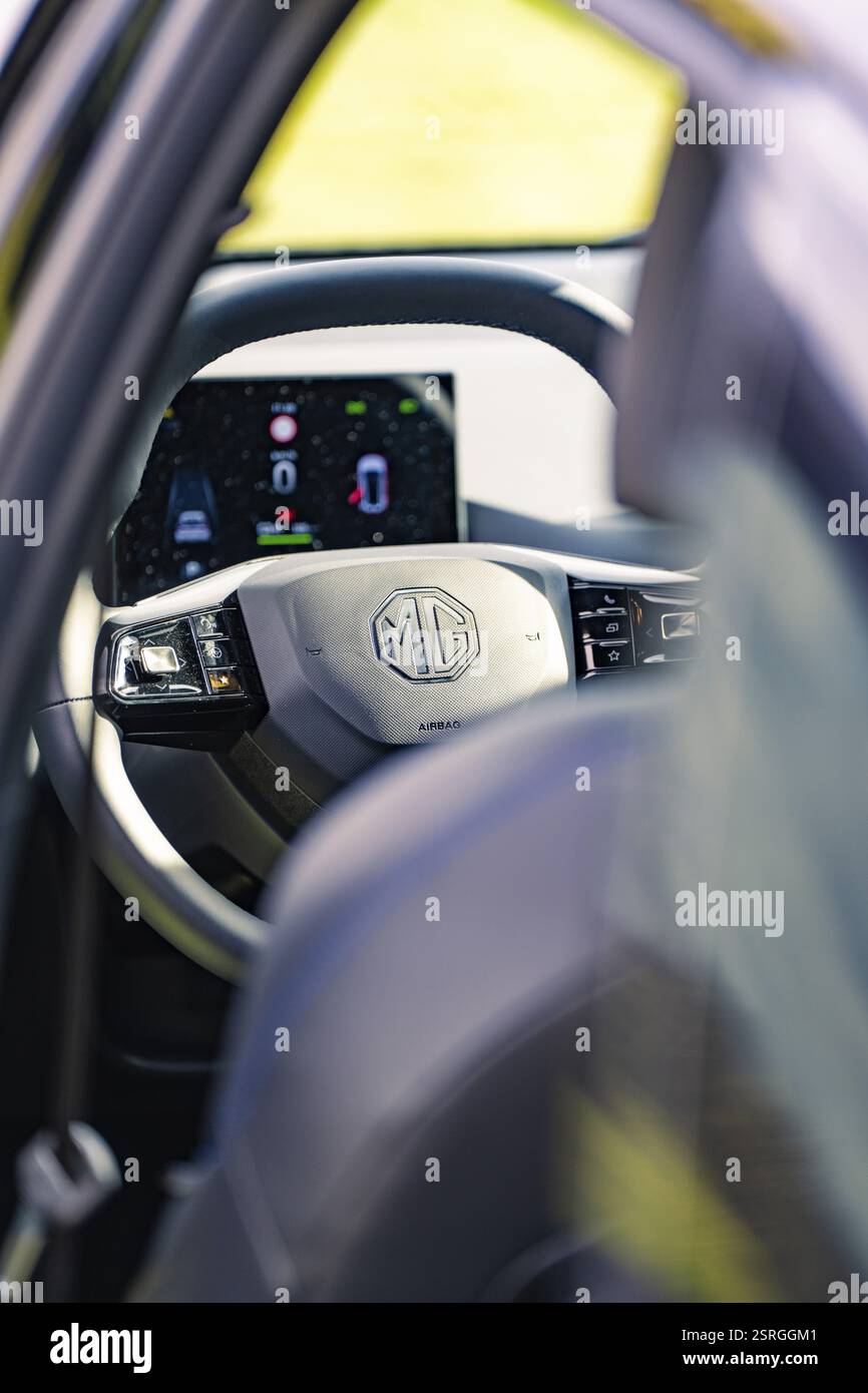 View of the steering wheel of a car and control elements, with visible ...