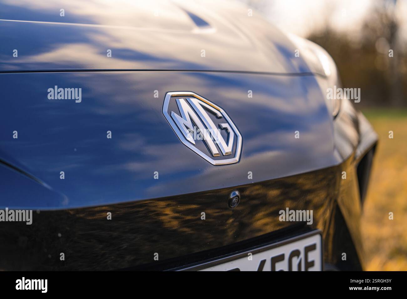 Close-up of a black car with MG logo in the sun, e-car sharing, Deer ...