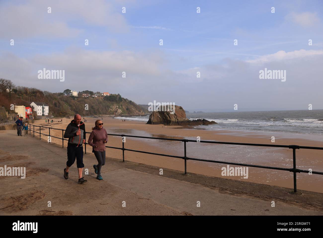 Tenby, UK. 16th Feb, 2025. UK Weather. Bright and breezy day as people ...