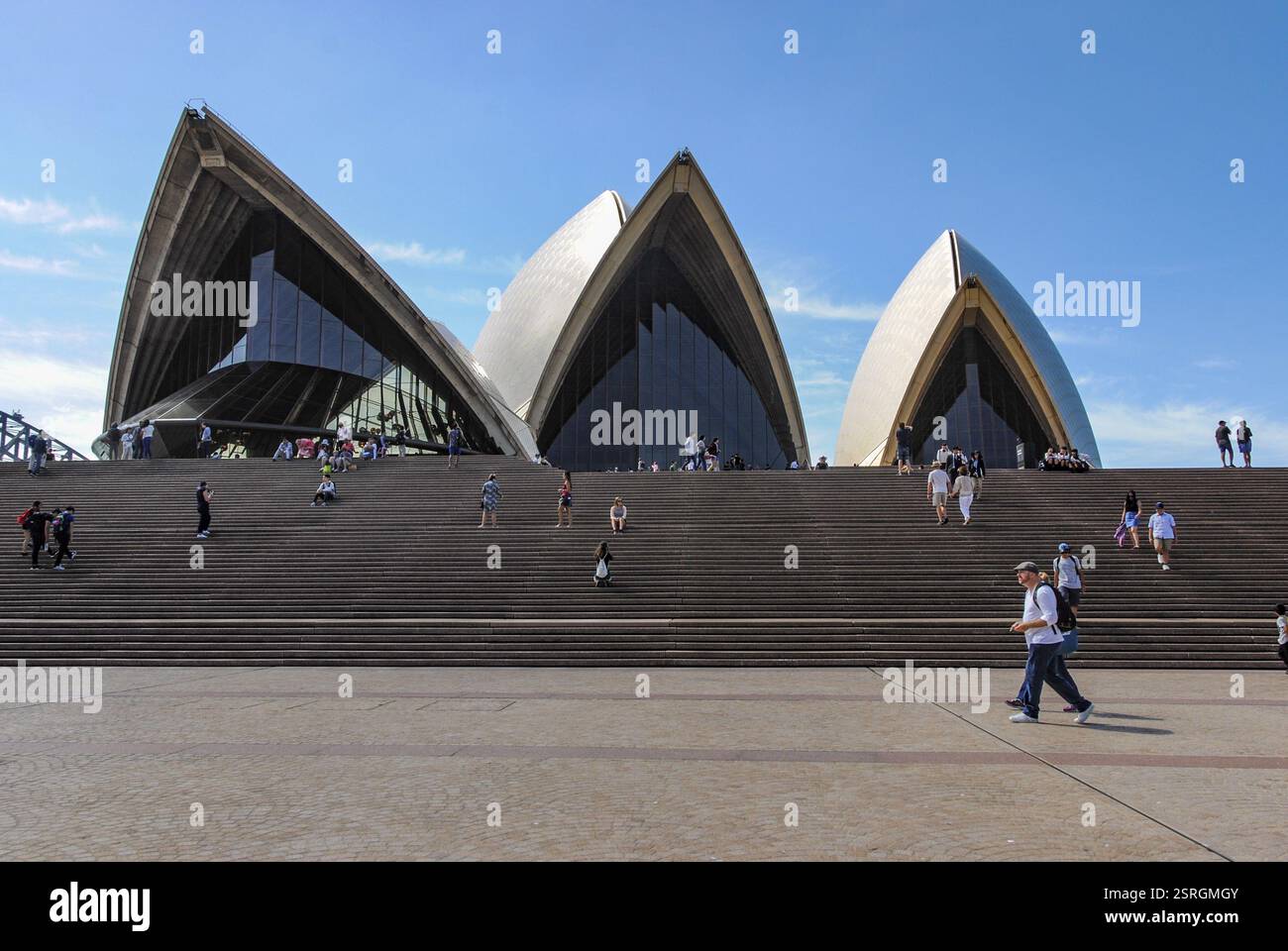 People gathered outside the iconic sails of the Sydney Opera House ...