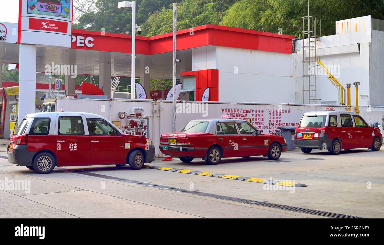 Taxis line up at gas station, Hong Kong Stock Photo - Alamy