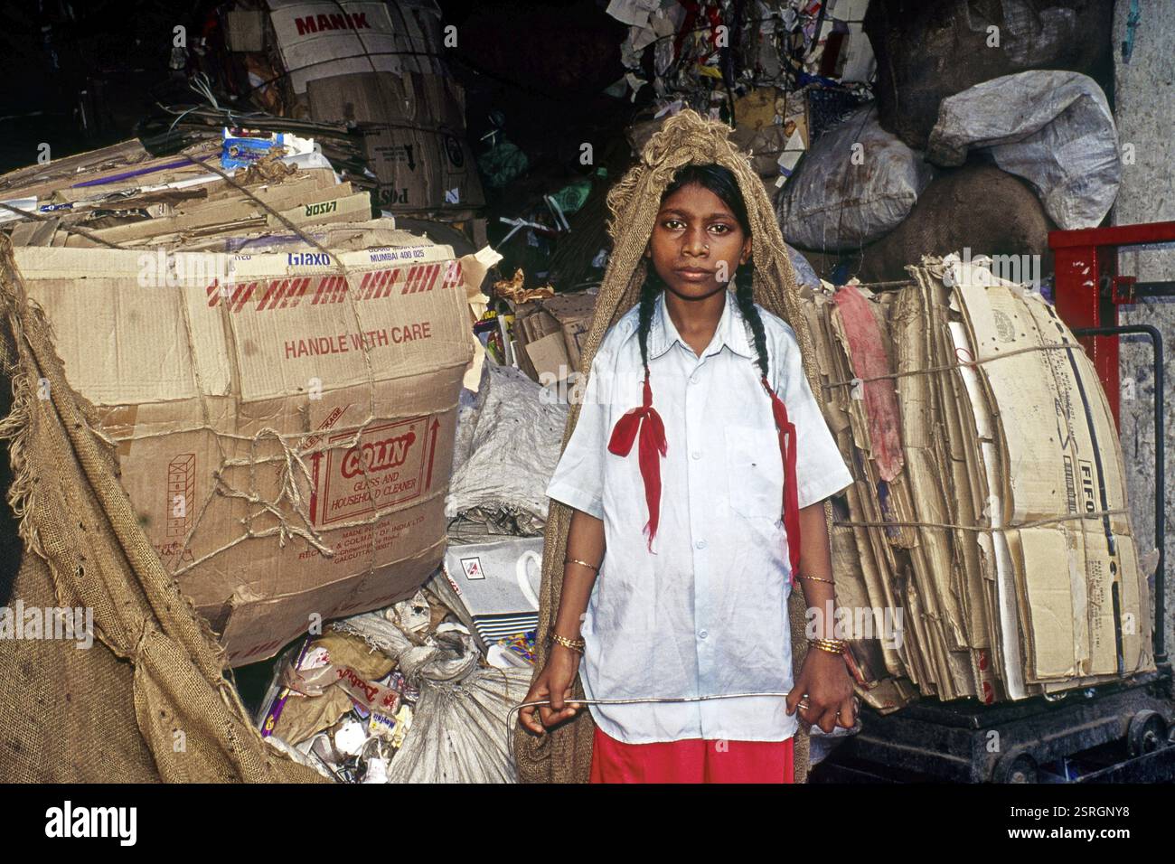 Rag picker girl with garbage collection bag on shoulder, Mumbai ...