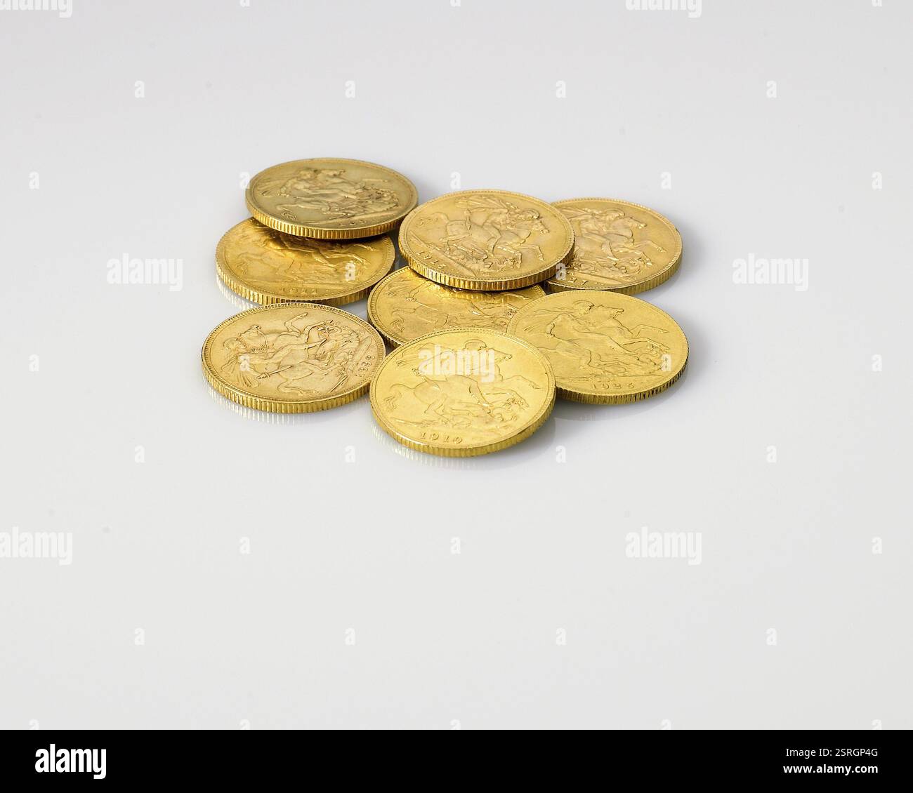 Gold coins on white background Stock Photo - Alamy