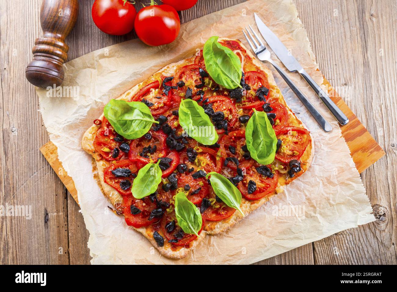 Homemade olive - tomato pizza Stock Photo - Alamy