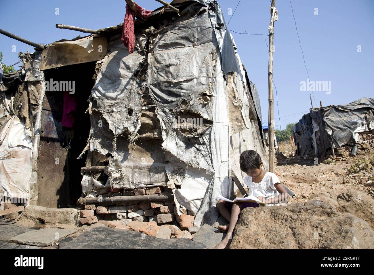 Girl doing homework, damu nagar, kandivali, mumbai, maharashtra, india ...