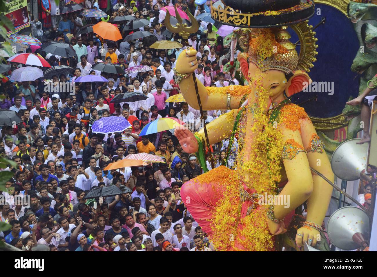 A gigantic idol of Hindu elephant-headed god Ganesh, being led to the ...