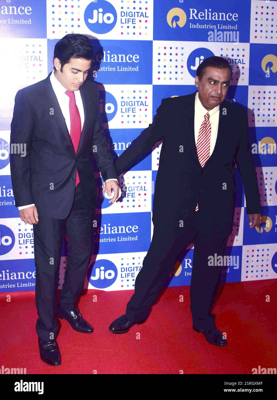 Reliance Industries Limited Chairman Mukesh Ambani with his son Akash Ambani Annual General ...