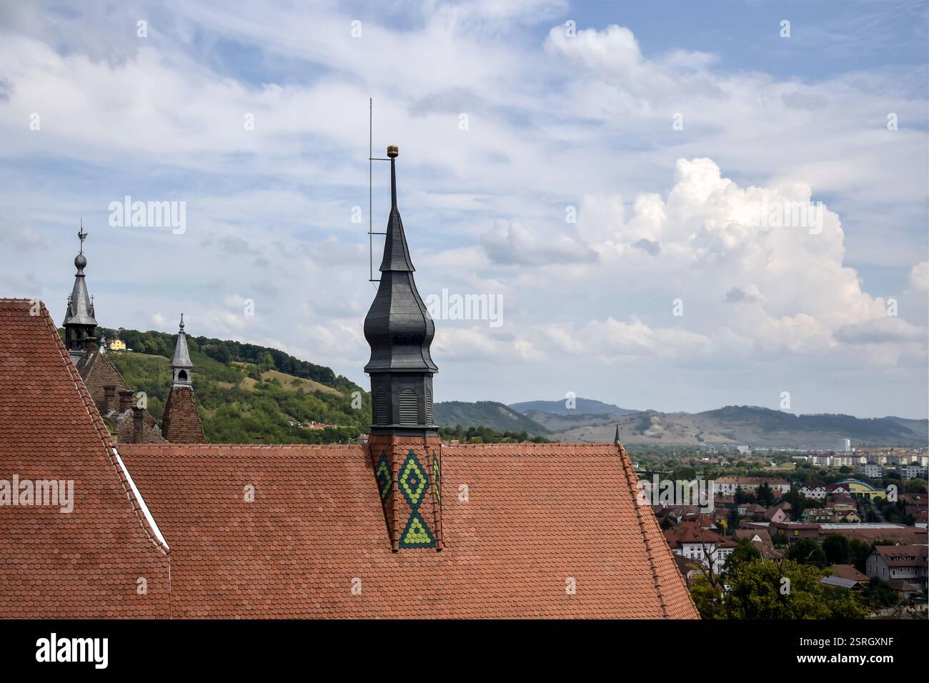 Stylized ventilation tower with lightning rod, installed on old red ...