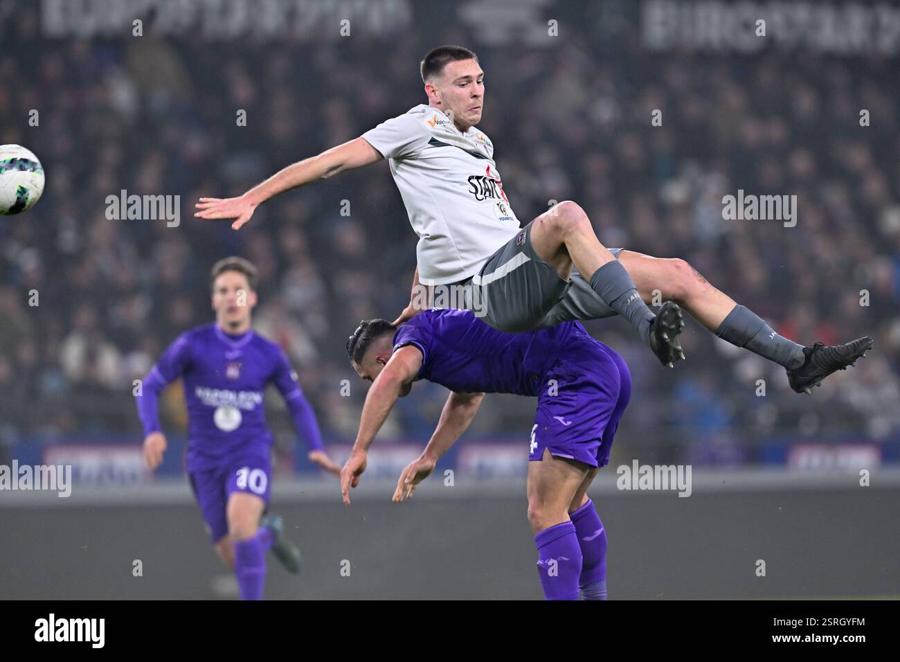 Anderlecht, Belgium. 27th Dec, 2024. Jan-Carlo Simic (4) of Anderlecht fighting for the ball ...