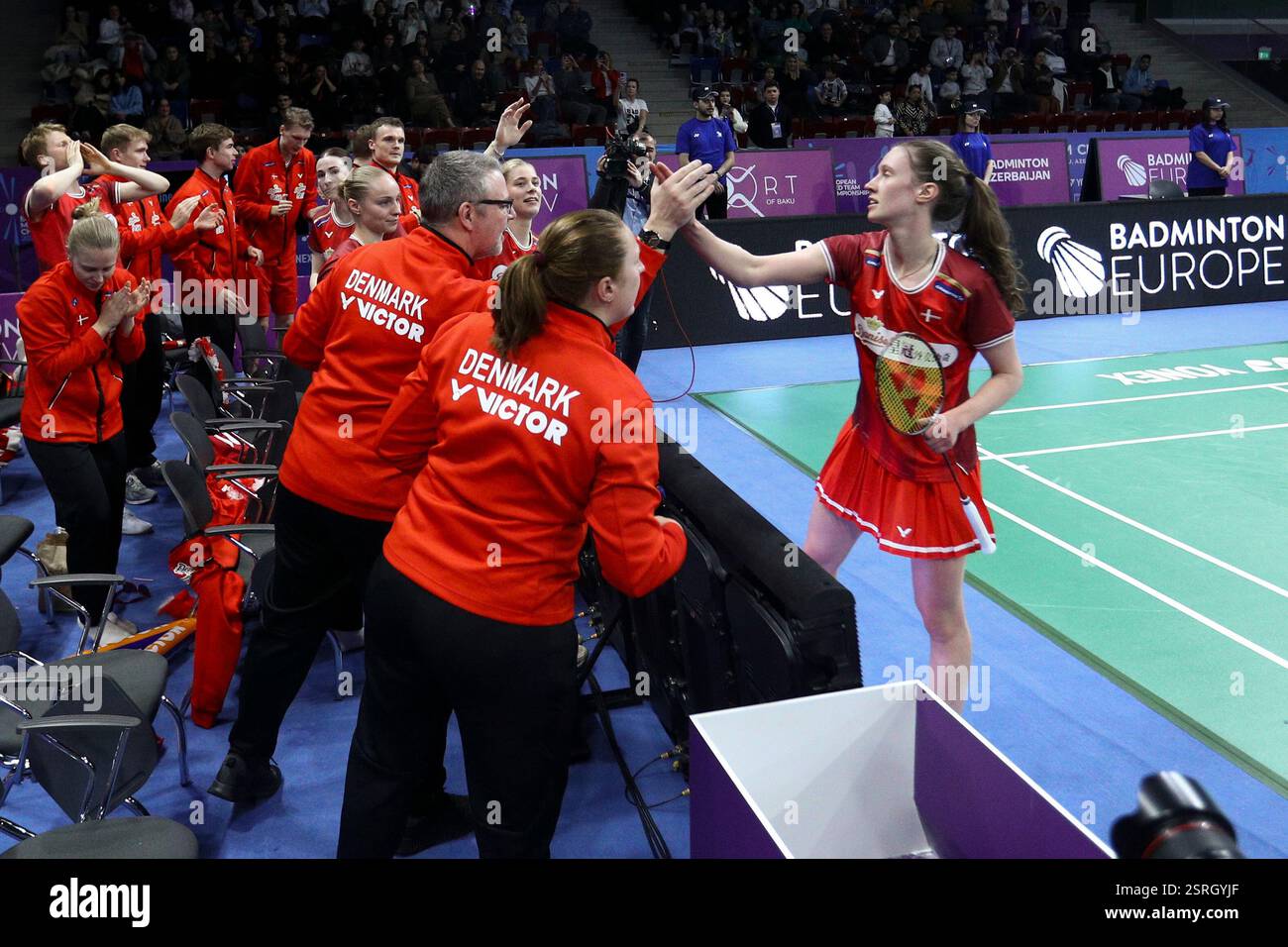 Line Christophersen of Denmark, right, celebrates her victory over ...