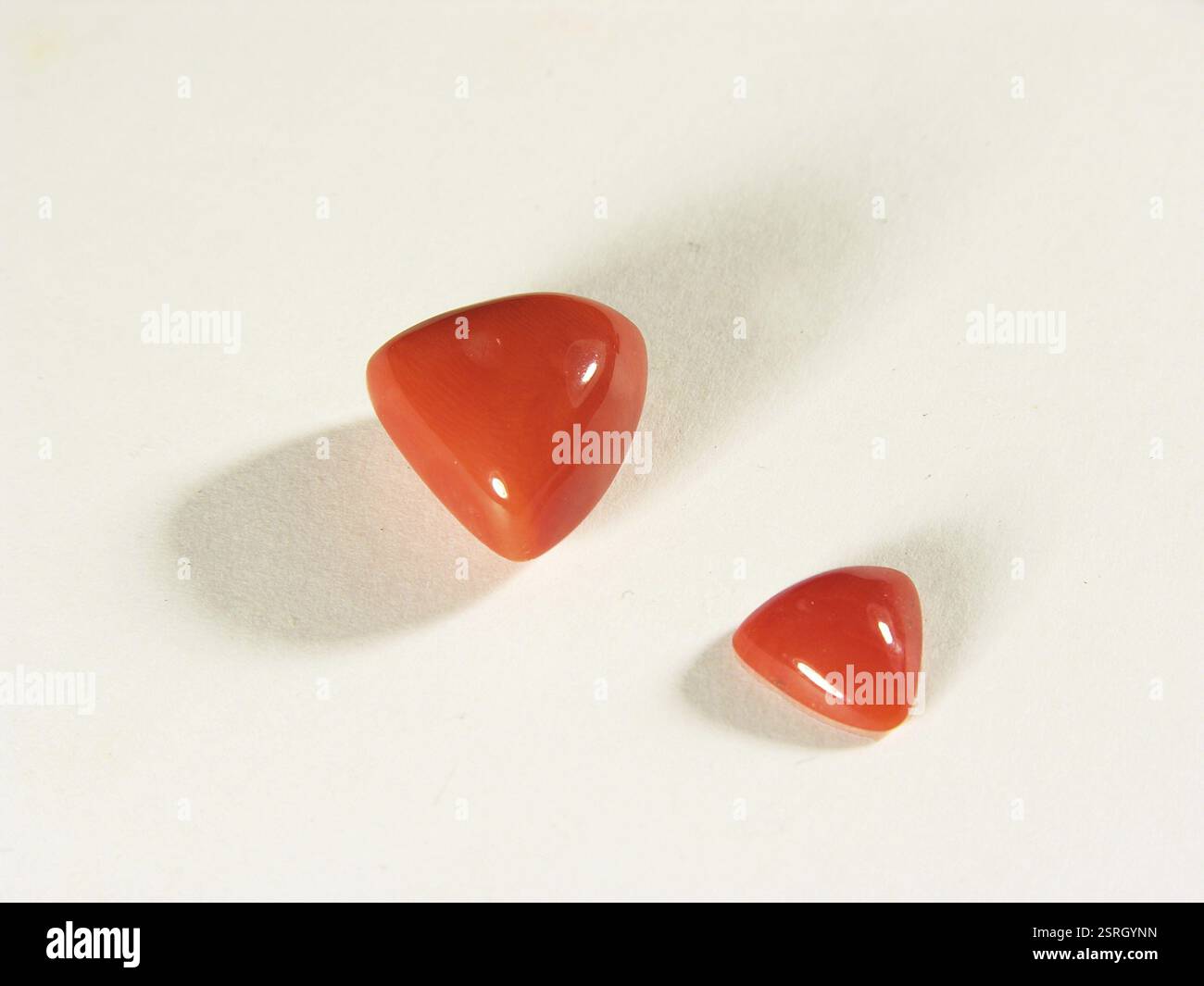 Triangle shape of coral munga gems according to astrology represents ...