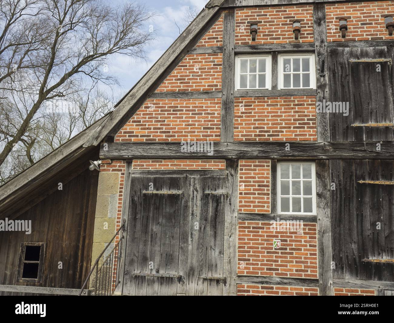 Rustic half-timbered house with striking wooden structure and red ...