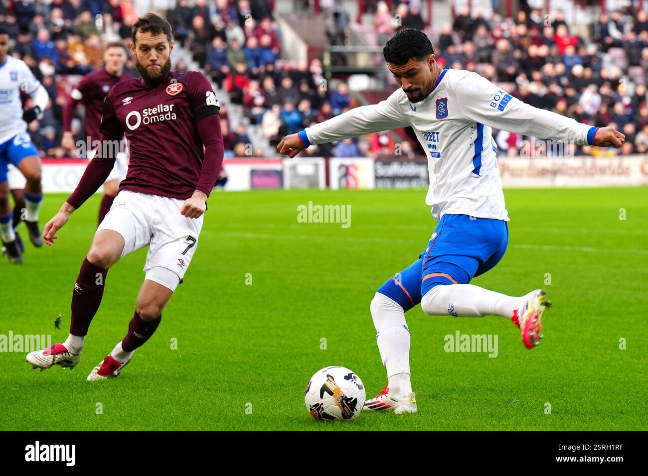Rangers' Jefte (right) and Heart of Midlothian's Jorge Grant battle for ...