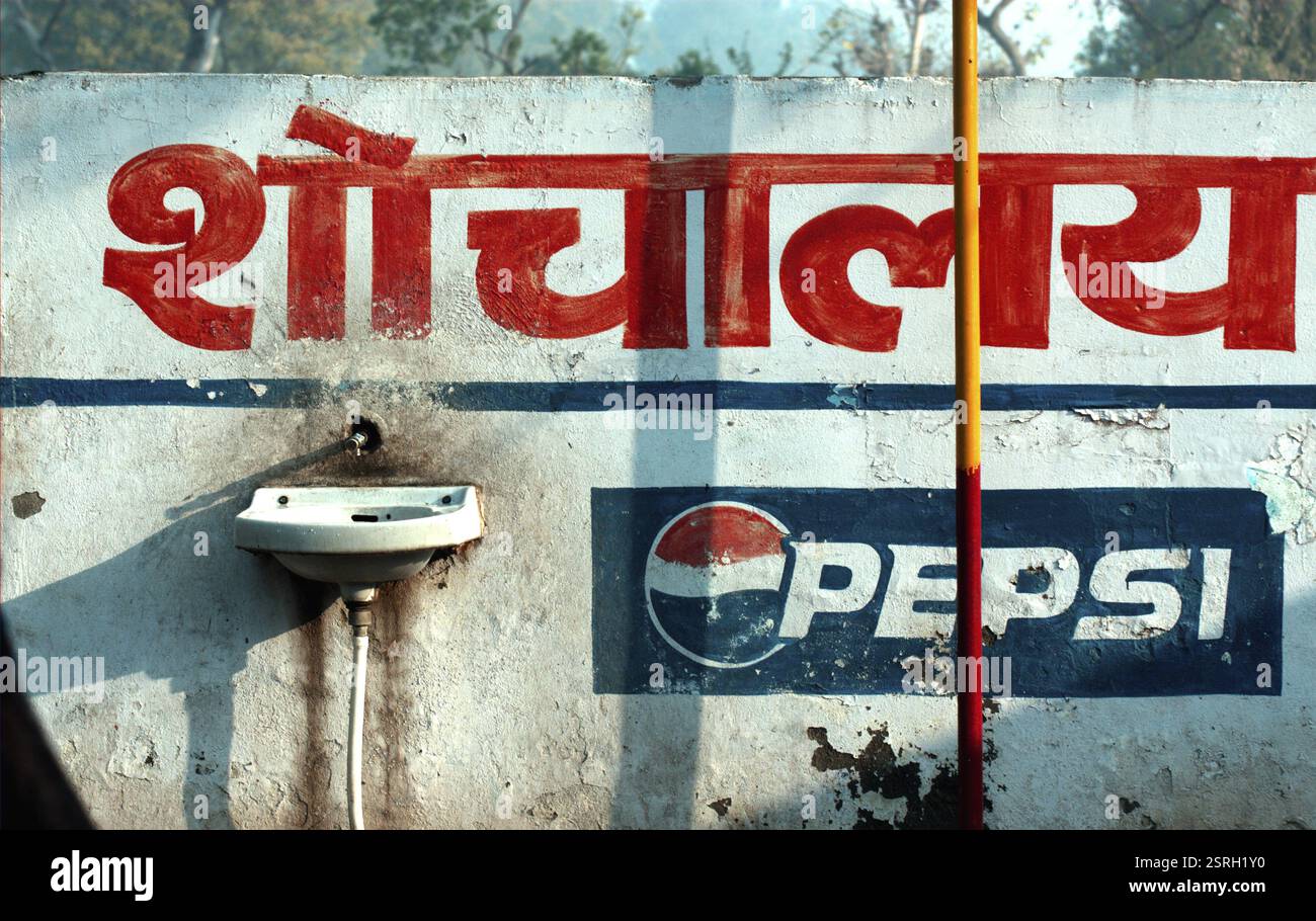 Toilet written in Hindi language on washbasin wall of roadside ...
