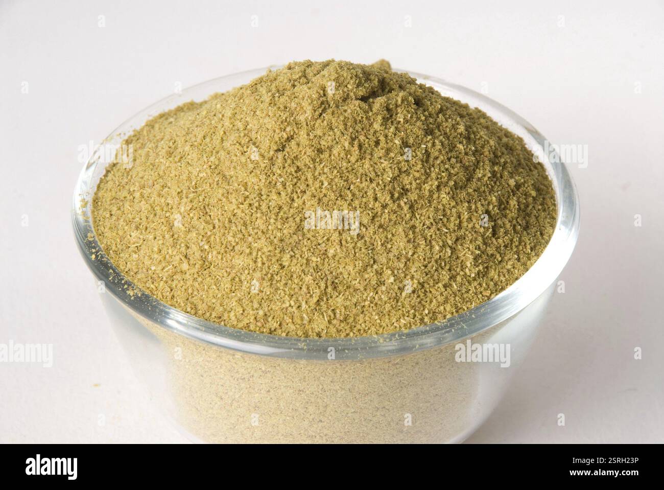 Spices, coriander powder dhania coriandrum sativum in bowl on white background Stock Photo - Alamy
