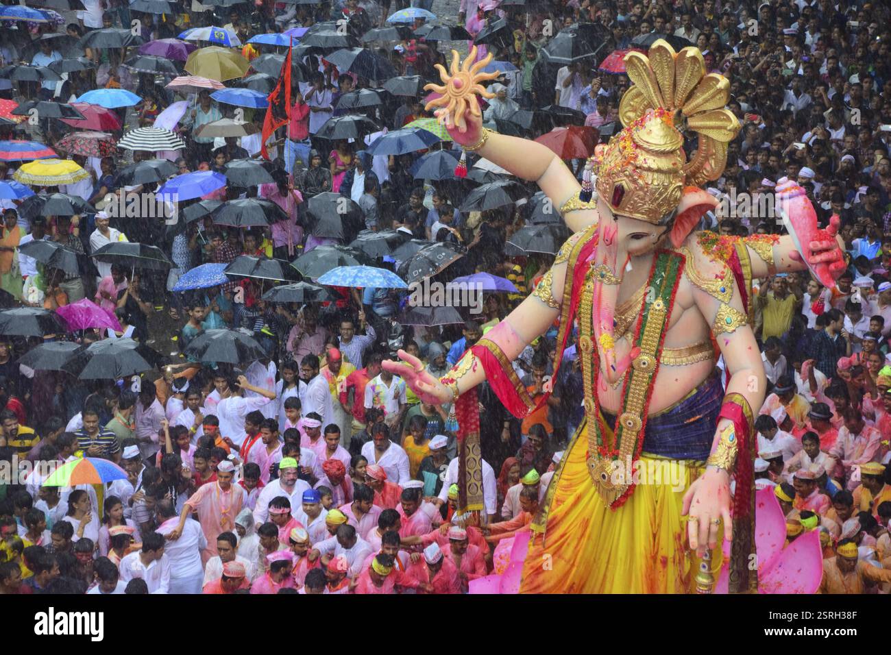 A gigantic idol of Hindu elephant-headed god Ganesh, being led to the ...
