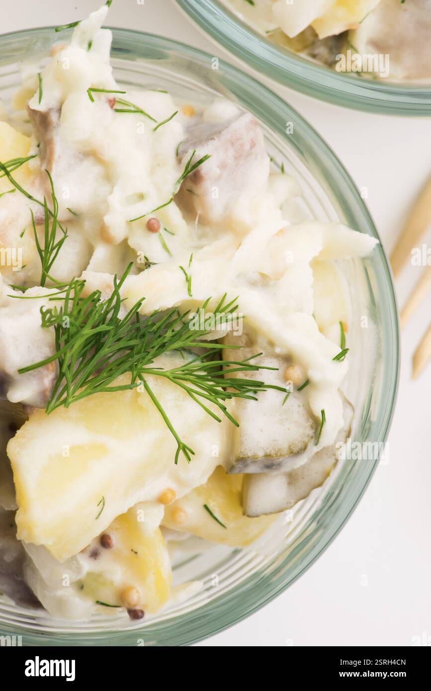Salad rasols made of herring, cucumber and potato, dressed with ...