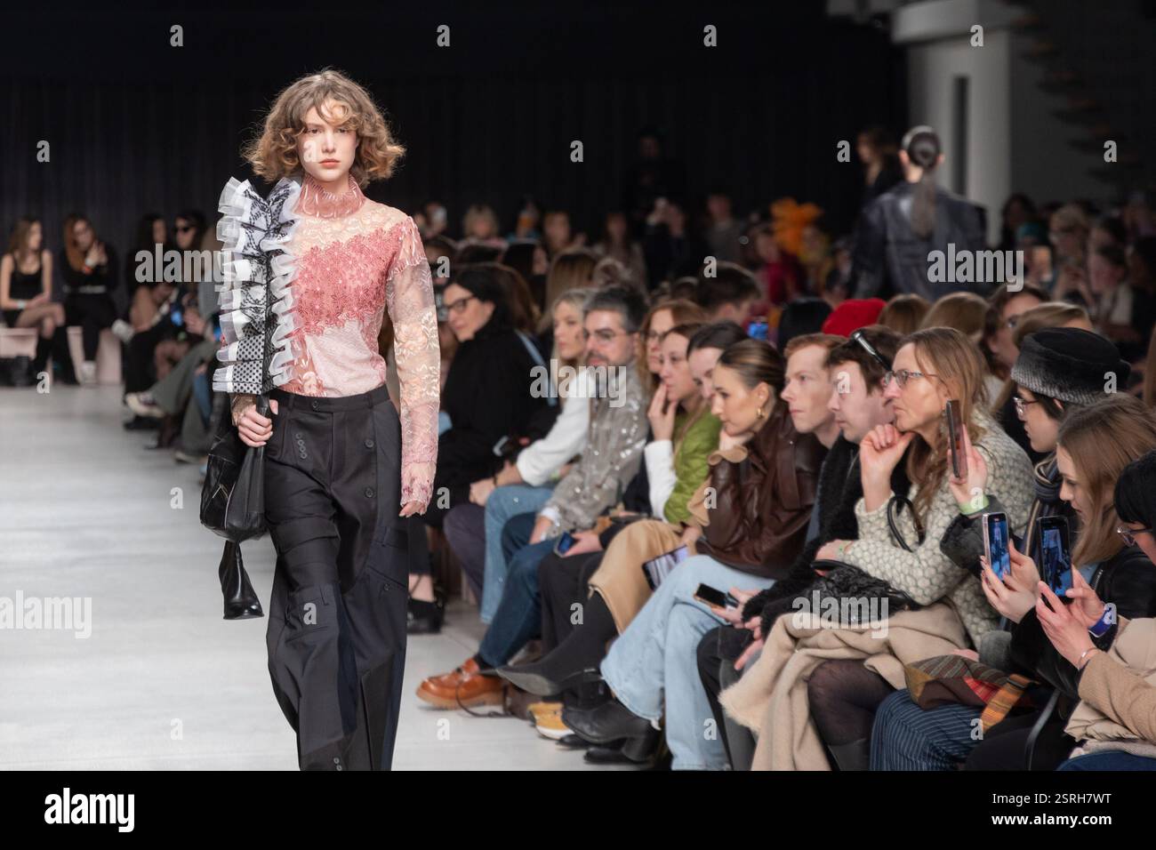 (250216) -- BUDAPEST, Feb. 16, 2025 (Xinhua) -- A model presents a creation by fashion designer ...