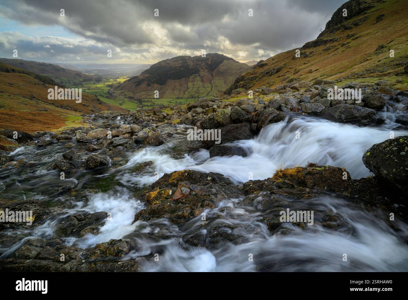 Lake District mountain waterfall Stickle Beck with dramatic view into ...