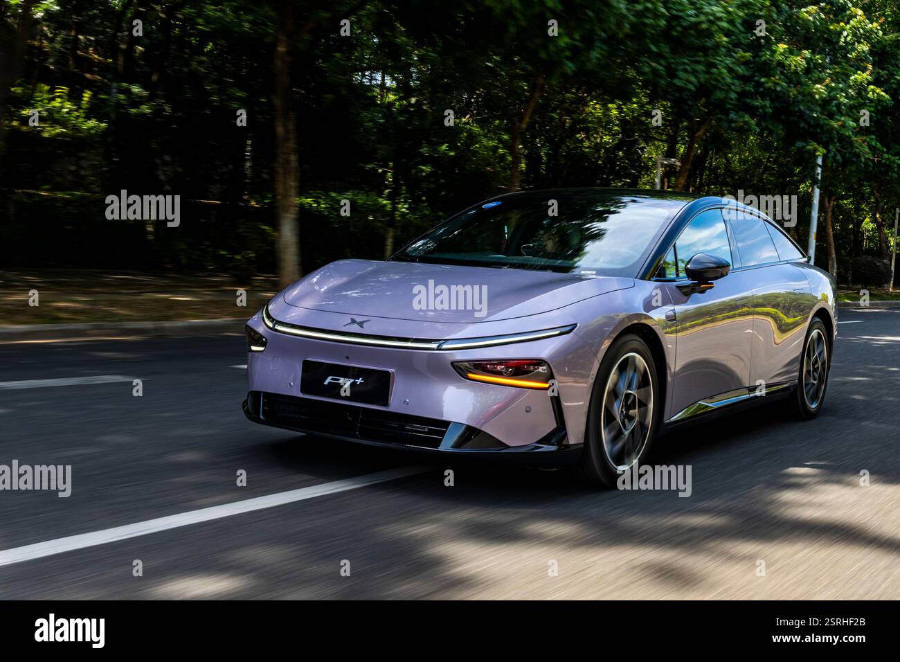 An XPeng P7+ Ultra Long Range Max version being driven on a test drive ...