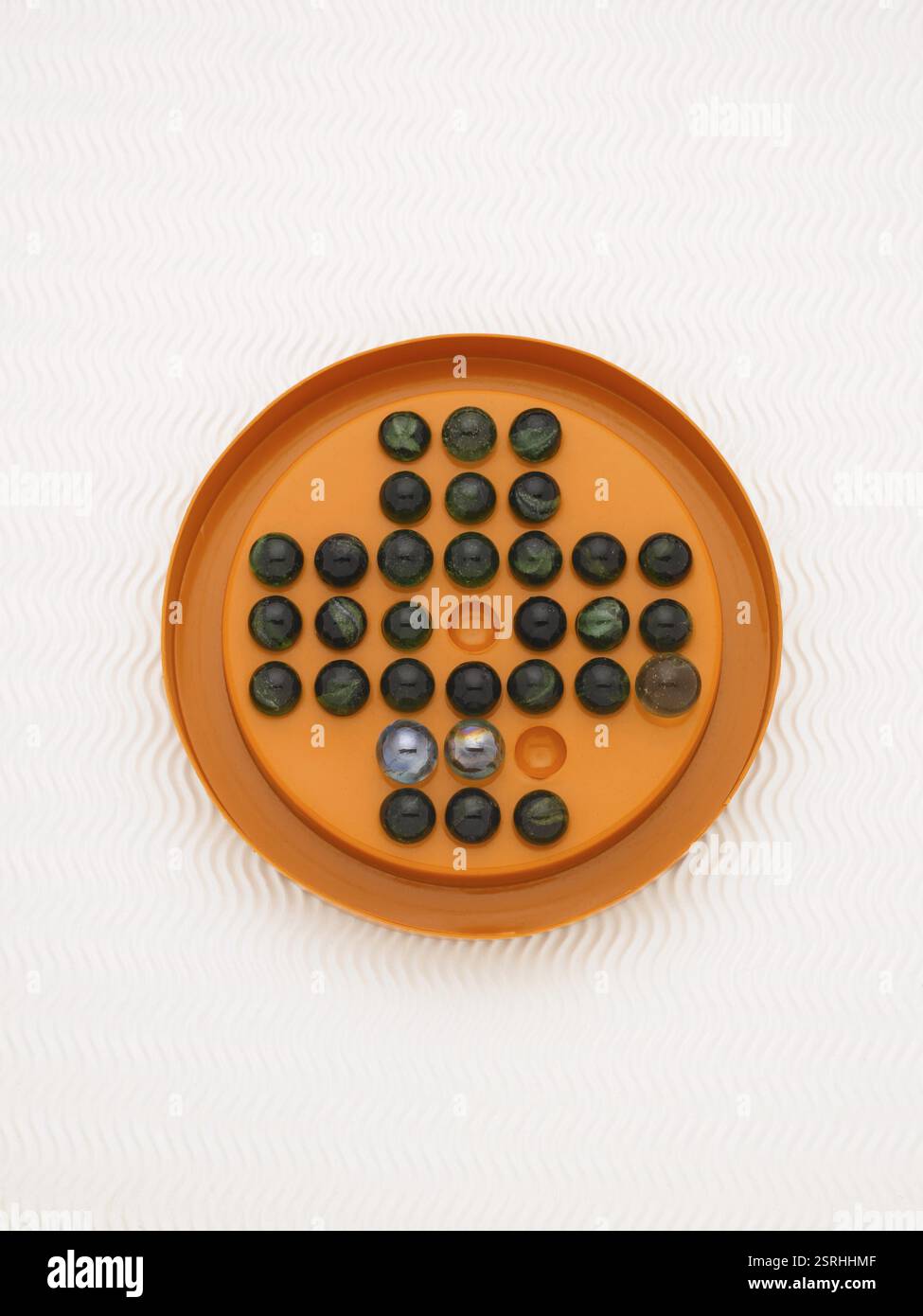 Marble solitaire game India Stock Photo - Alamy