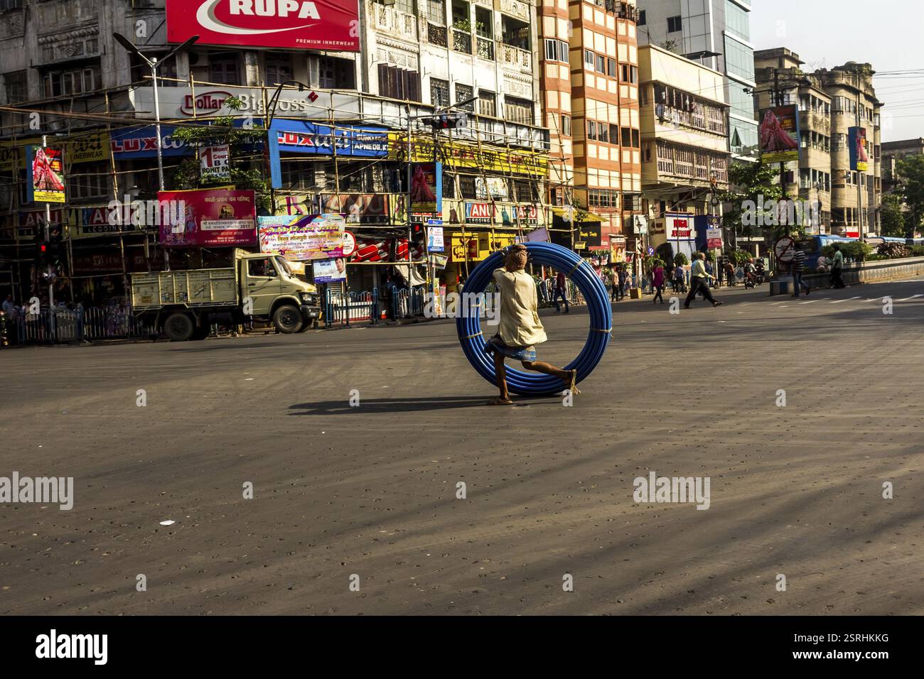 Man carrying cable wire on road, Manicktala, Kolkata, West Bengal ...