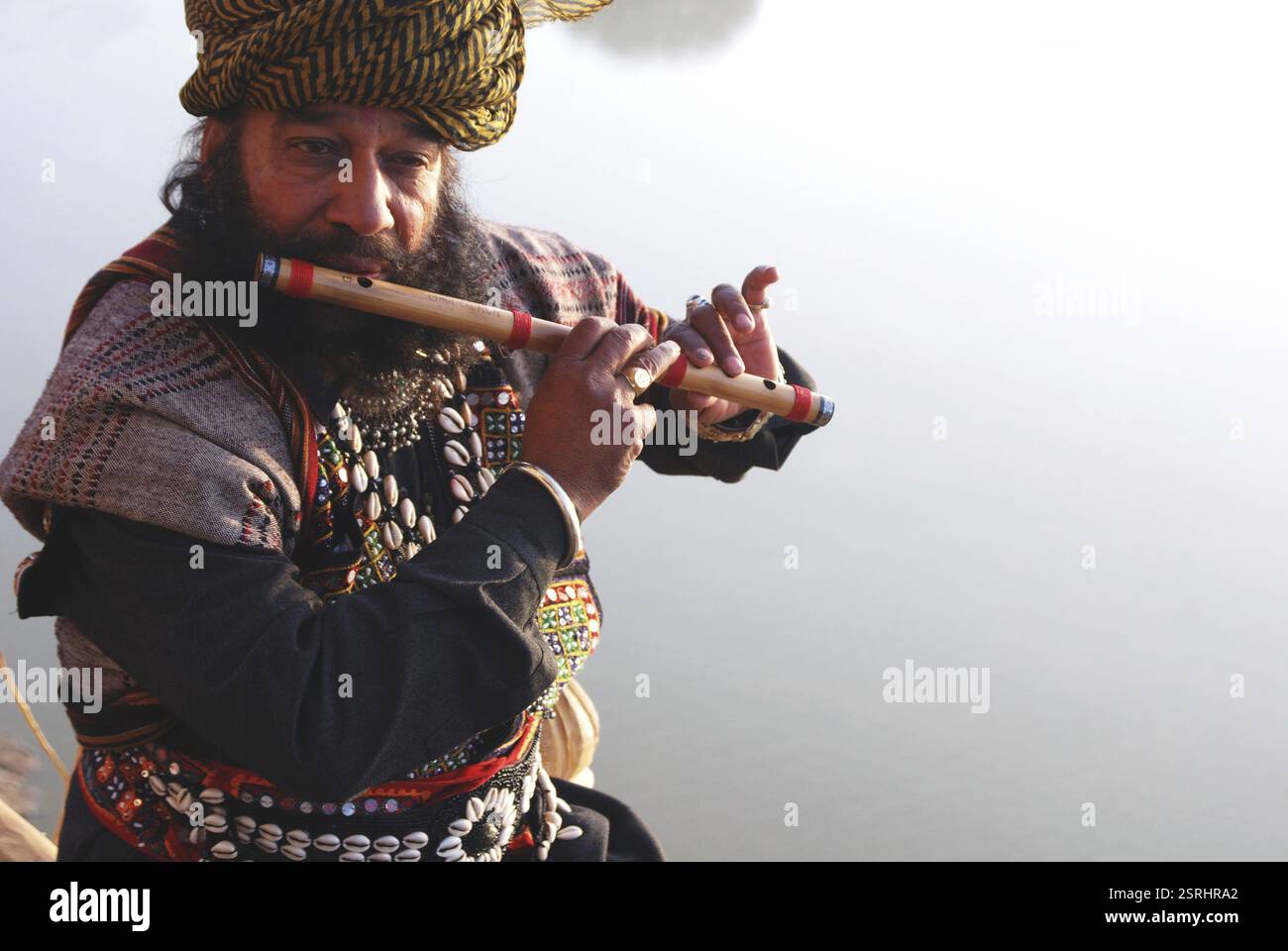 Man playing flute at gadisar lake, Jaisalmer, Rajasthan, India MR#704D ...