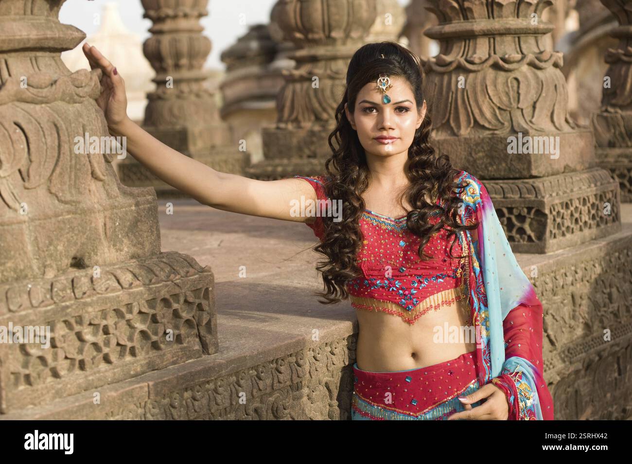 Lady in traditional wearing standing at heritage structure, India MR ...