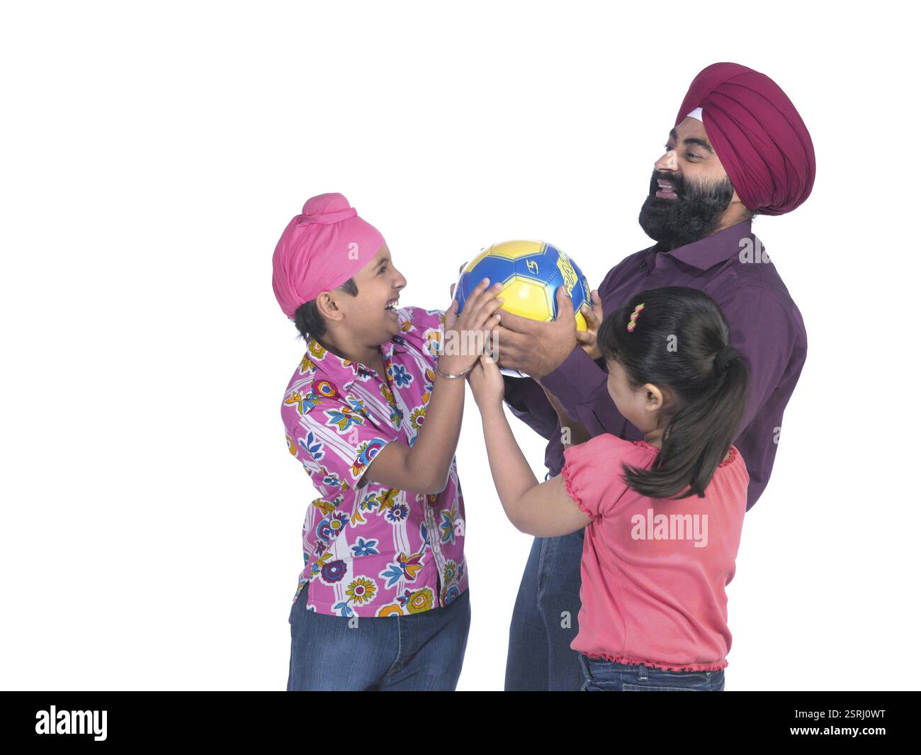 Sikh father with children playing with ball MR#702X, 702Y, 779A Stock ...