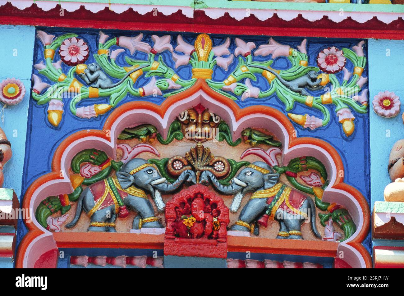 Richly painted entrance over door of Shri Vigneshwar temple, Ozar ...