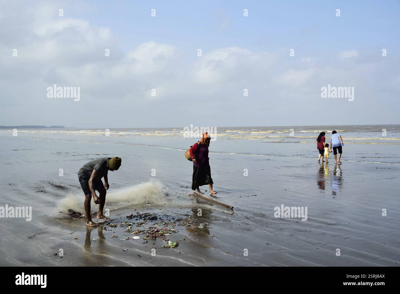 Fisherman couple fishing, Nargol Beach, Valsad, Gujarat, India, Asia ...