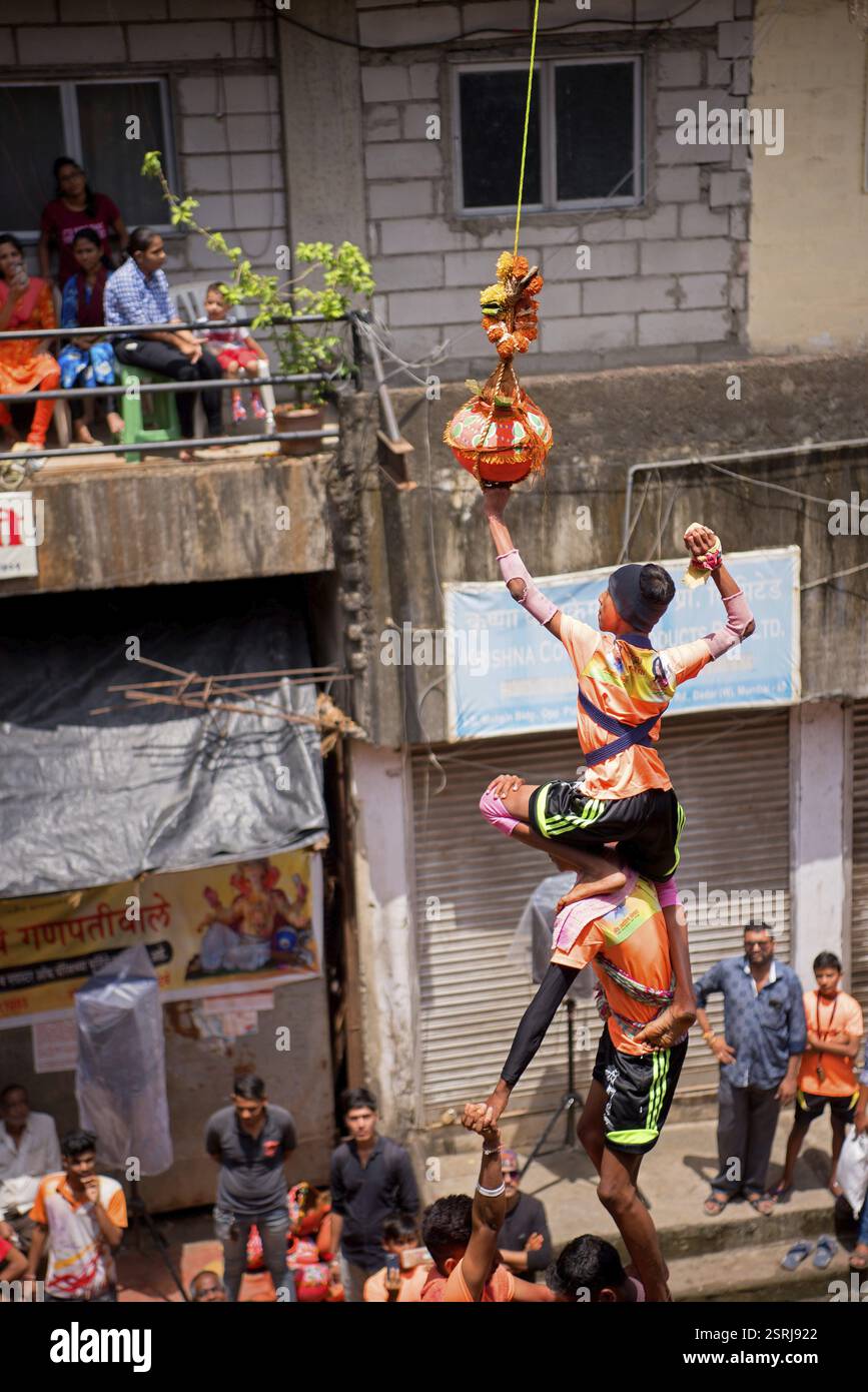 Men human pyramid breaking Dahi Handi, Janmashtami festival, Mumbai ...