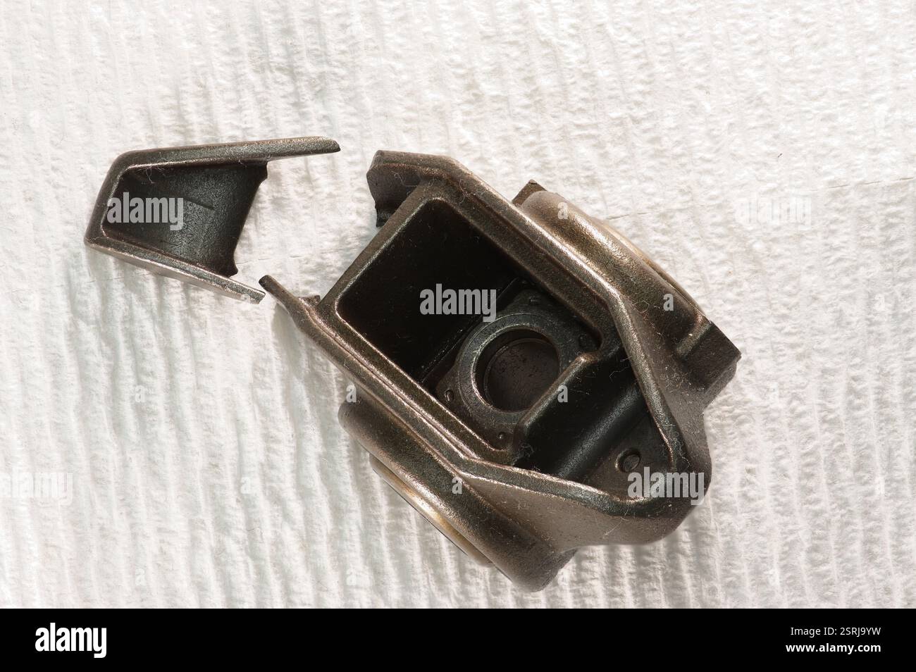 Broken rocker arm from a gasoline engine Stock Photo - Alamy