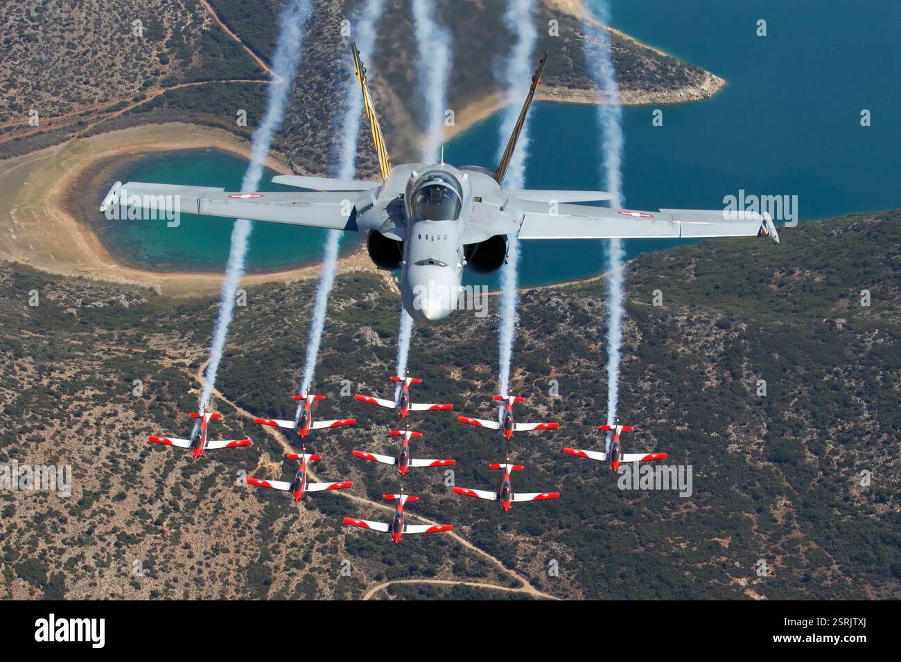 Swiss Air Force F/A-18 Hornet with PC-7 Team, demonstrating the ...
