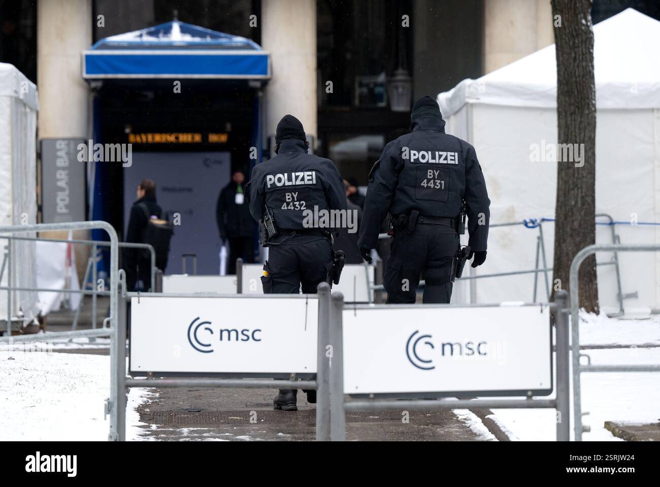 Munich, Germany. 16th Feb, 2025. Police officers stand in front of the ...
