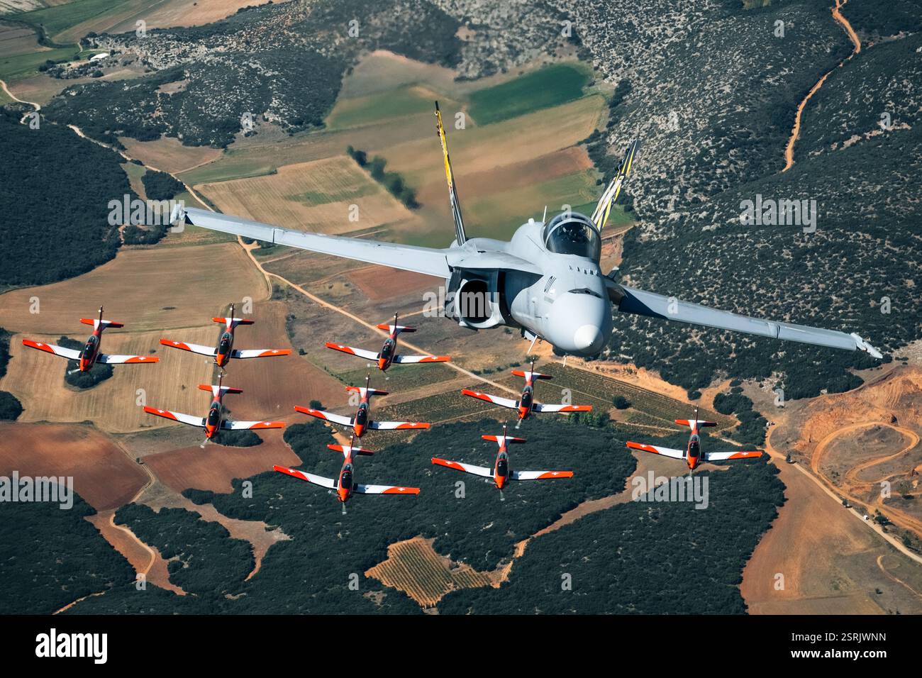Swiss Air Force F/A-18 Hornet and PC-7 Team performing coordinated ...